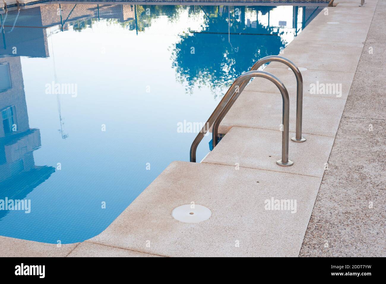 calm pool blue water stair curb summer calm Stock Photo - Alamy