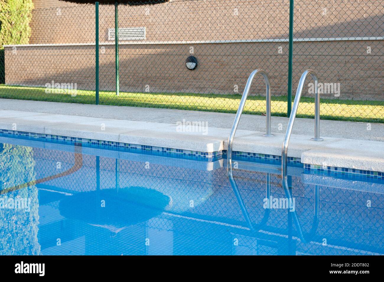 calm pool blue water stair curb summer calm Stock Photo - Alamy
