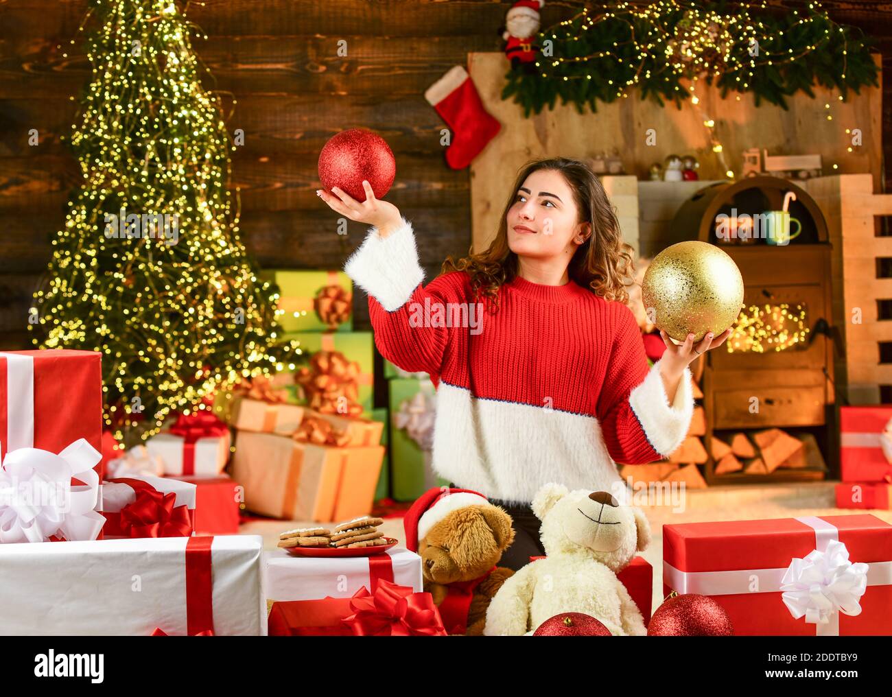 girl santa among xmas gifts and presents box. cyber monday shopping ...