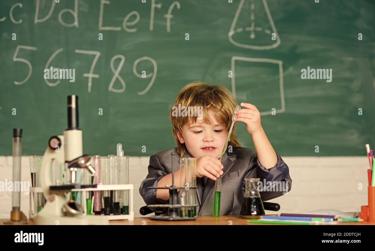biology science. science experiments with microscope in lab. school kid ...