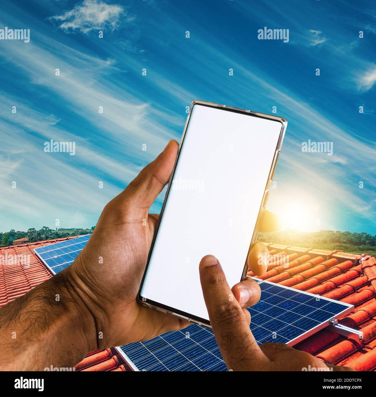 Male hands holding a mobile with solar energy photovoltaic panel at ...