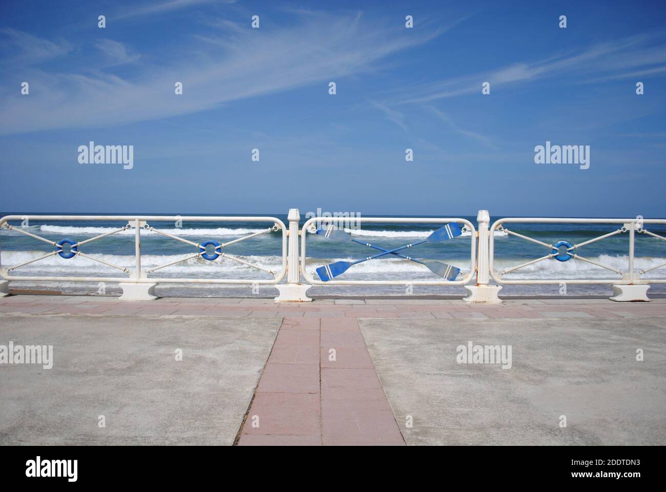 white and blue rusted fence with paddles at promenade in Europe in ...