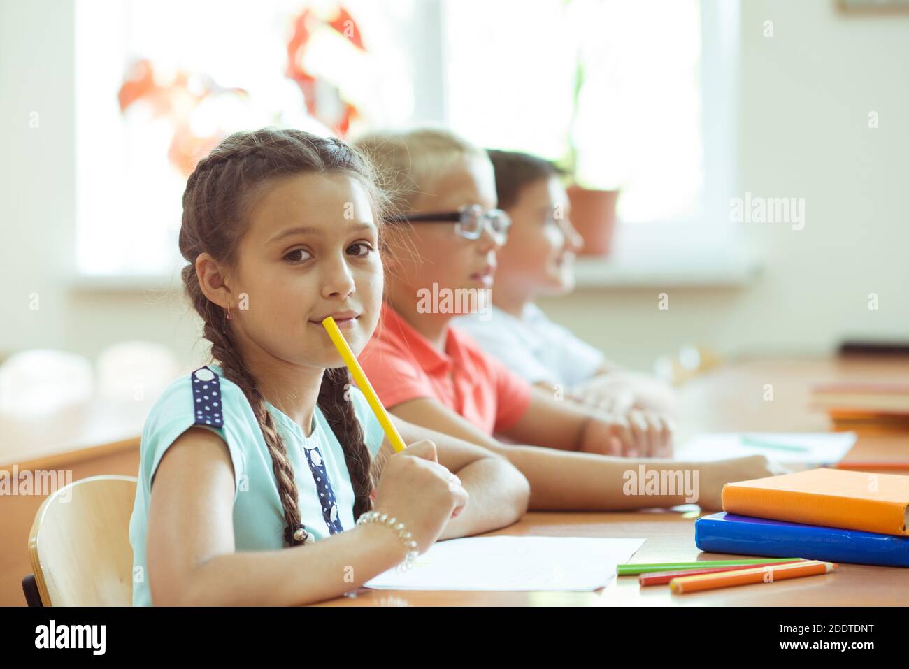 Happy clever children learning in classroom and having fun Stock Photo ...