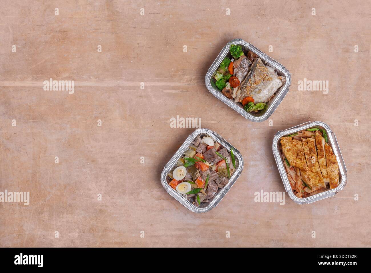 take away lunch boxes with fresh meal in foil container or healthy food ...