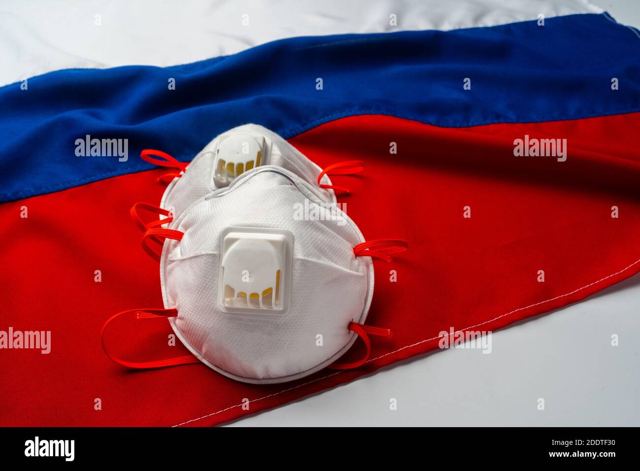 Medical face masks on flag of Russia Stock Photo - Alamy