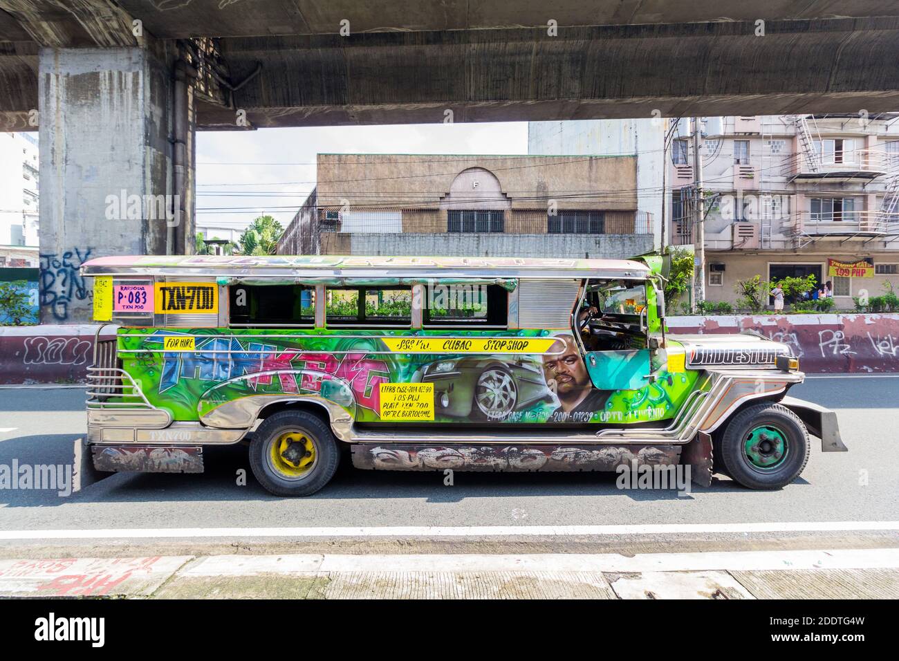 A Philippine jeepney plying the streets of Manila, Philippines Stock ...
