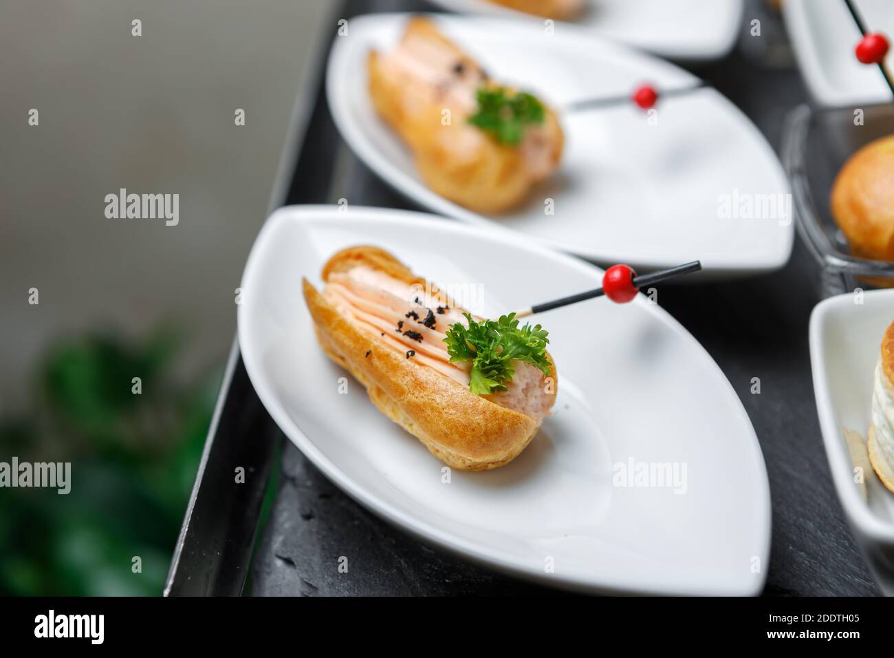 Roll with pate, seasoned with herbs and spices on a plate. Copy space ...