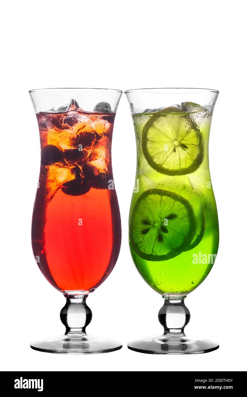 Green and red cocktail with lemon and ice on a white isolated ...