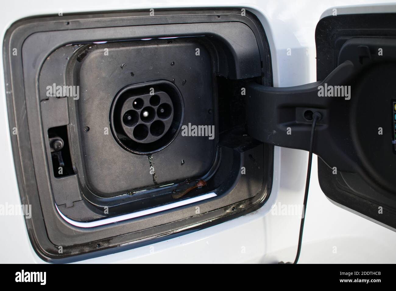 Electric Car Charger At Home - Charging EV with lights on Stock Photo ...