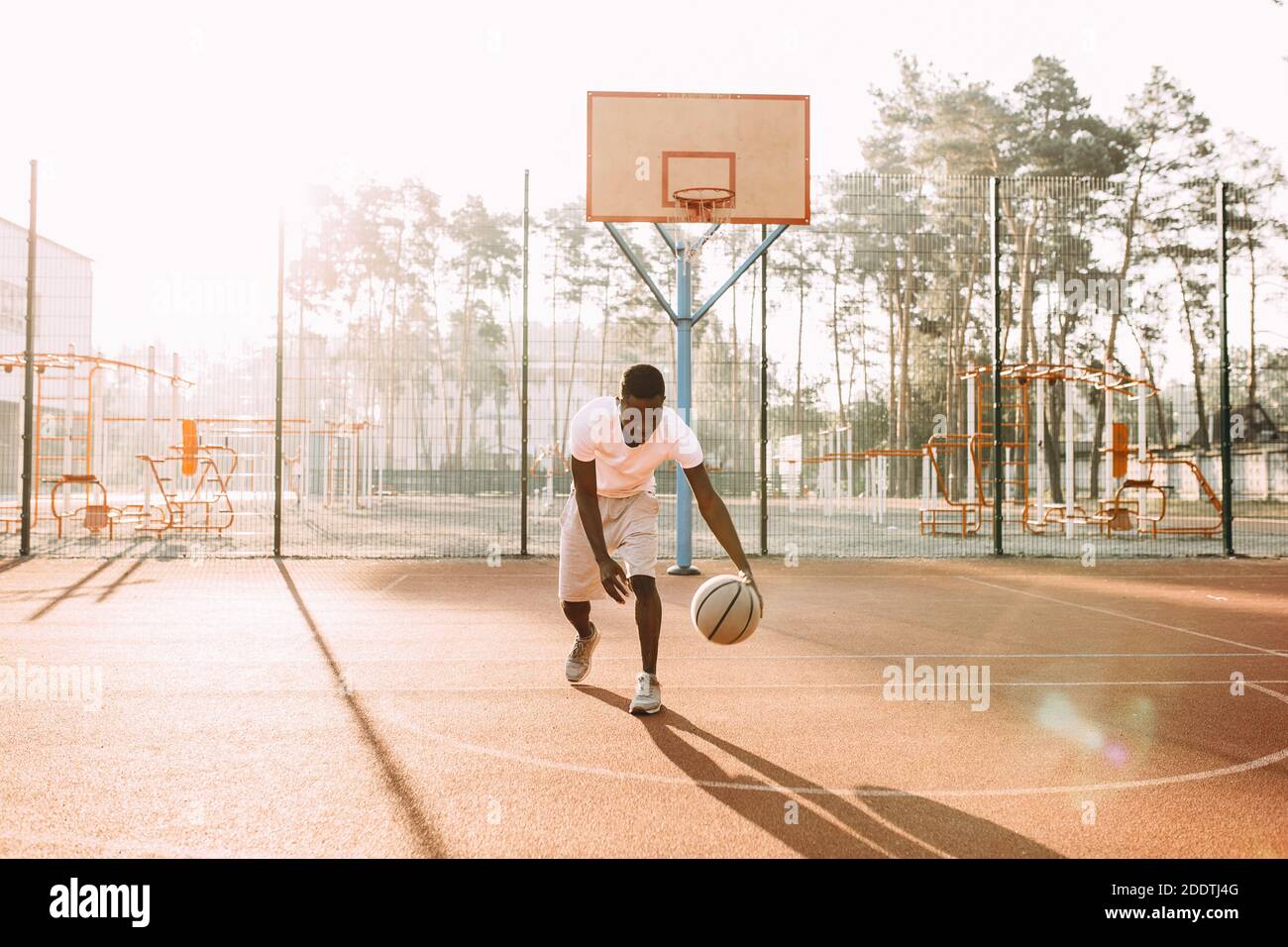 Strong handsome young African sports people in the stadium in the open ...