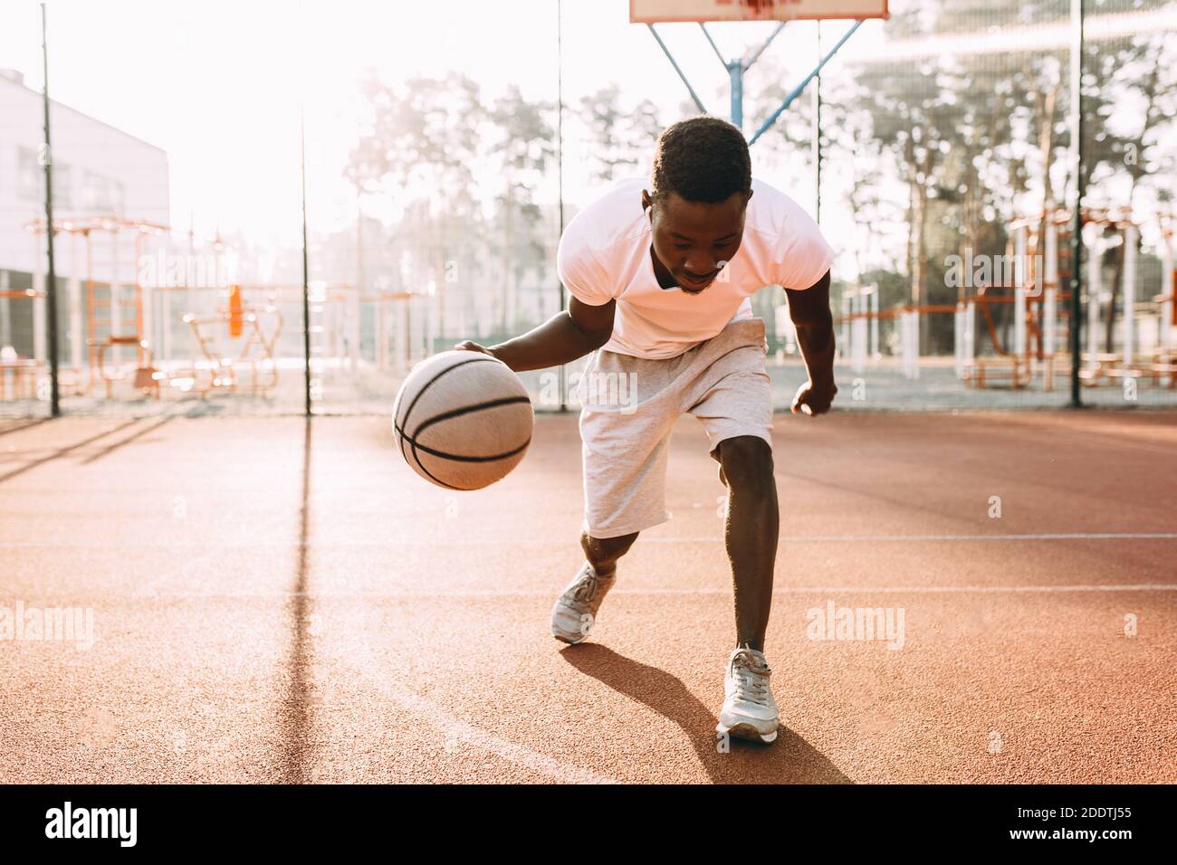 Strong handsome young African sports people in the stadium in the open ...
