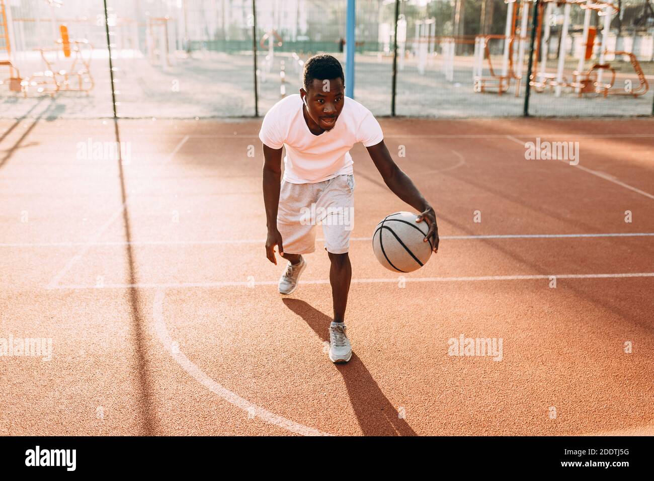 Strong handsome young African sports people in the stadium in the open ...