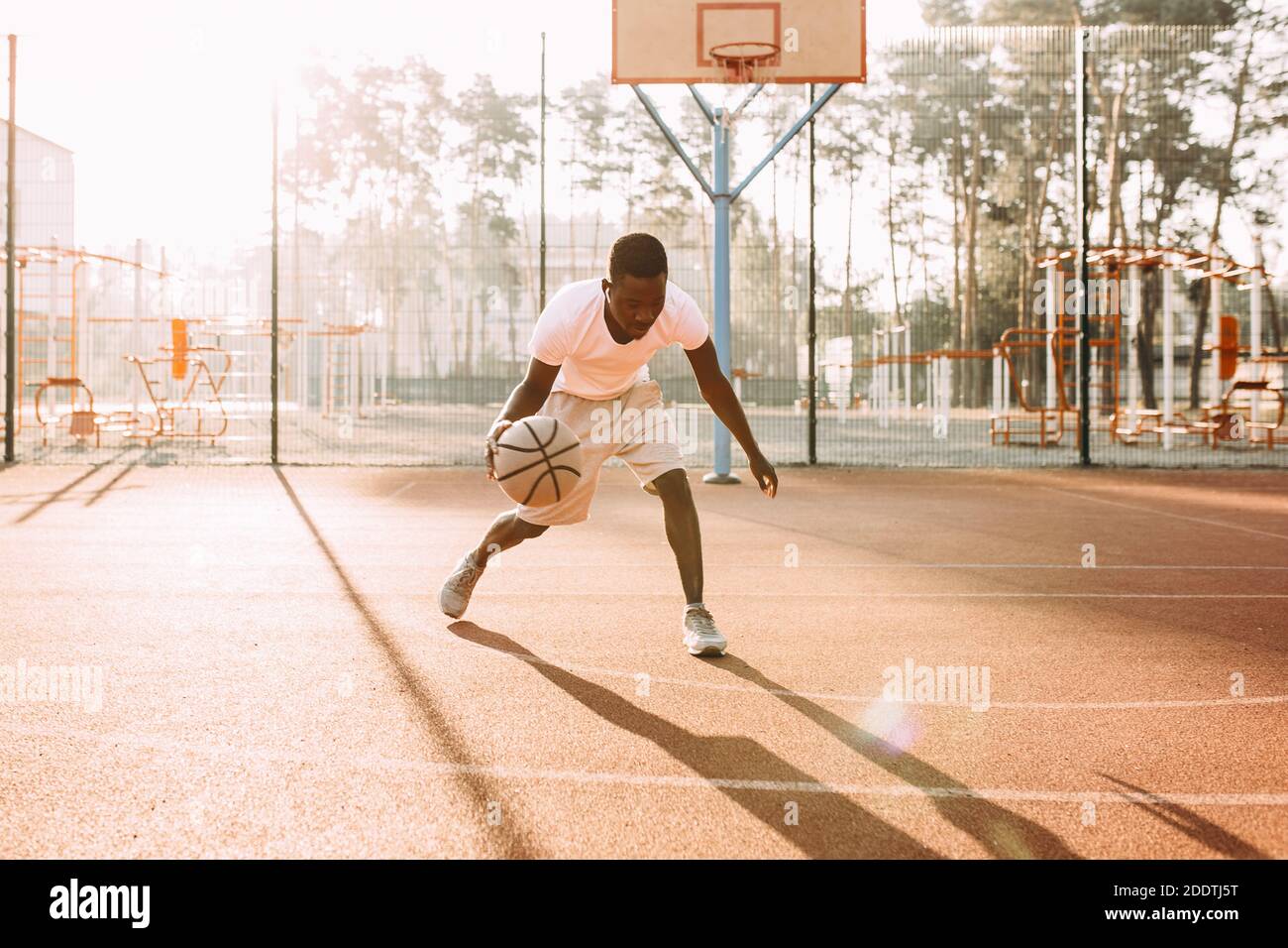 Strong handsome young African sports people in the stadium in the open ...