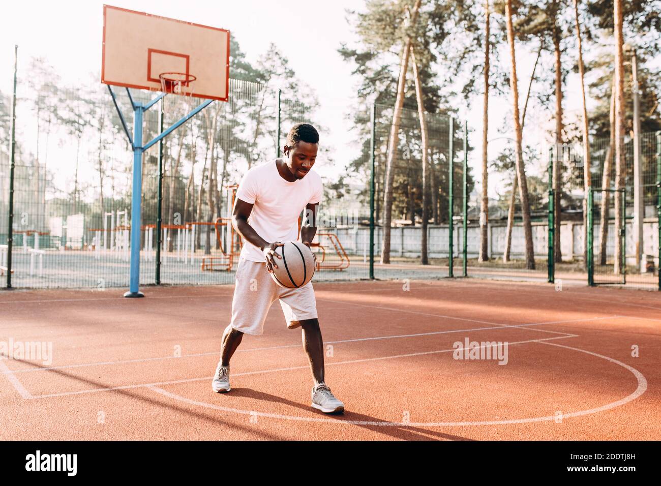 Strong handsome young African sports people in the stadium in the open ...