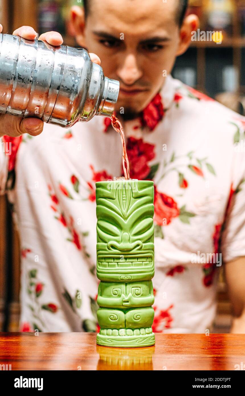 Bartender serving alcoholic cocktail in the Tiki Stock Photo - Alamy