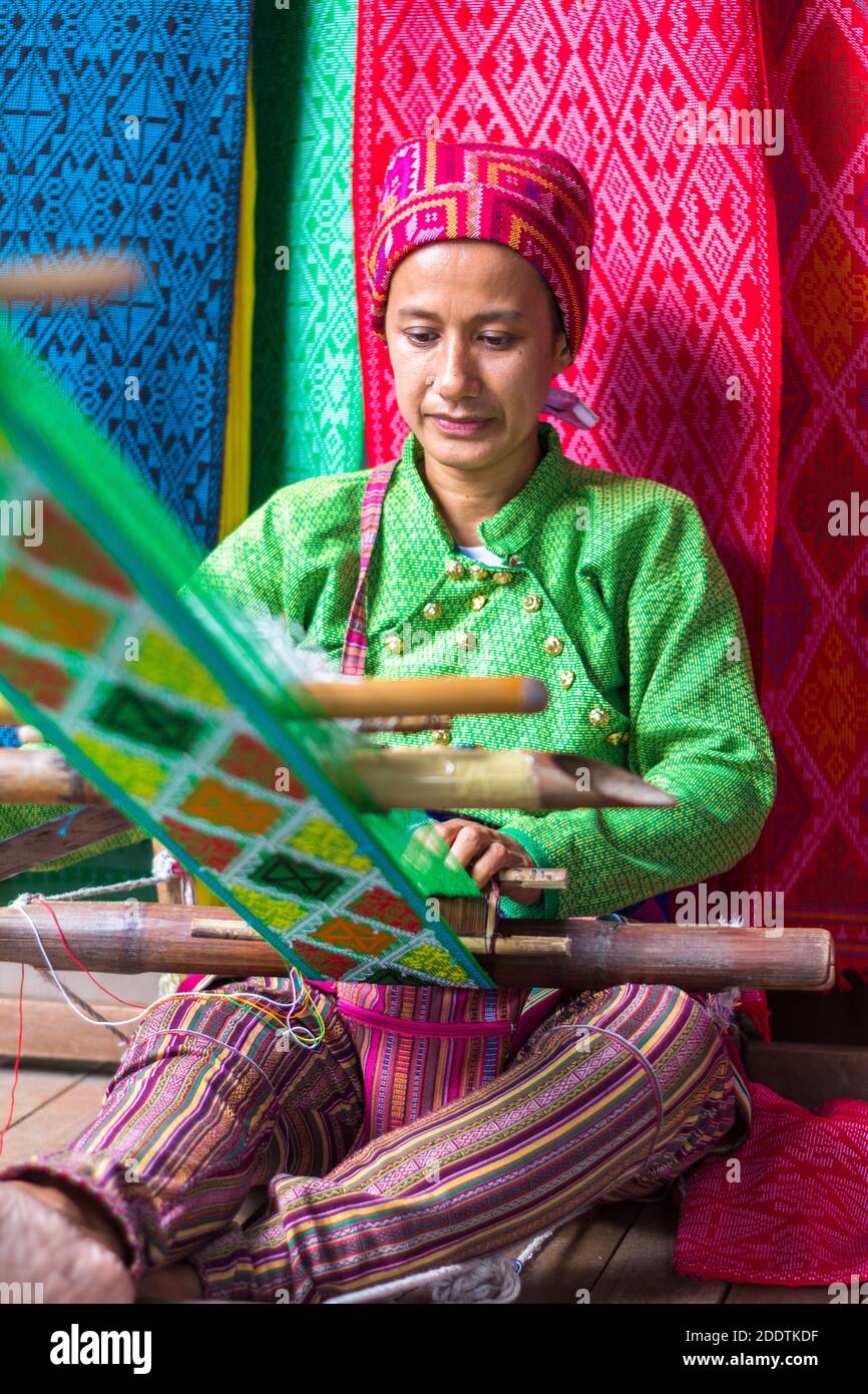 Evelinda Otong Hamja wearing traditional Yakan clothes weaving at the ...