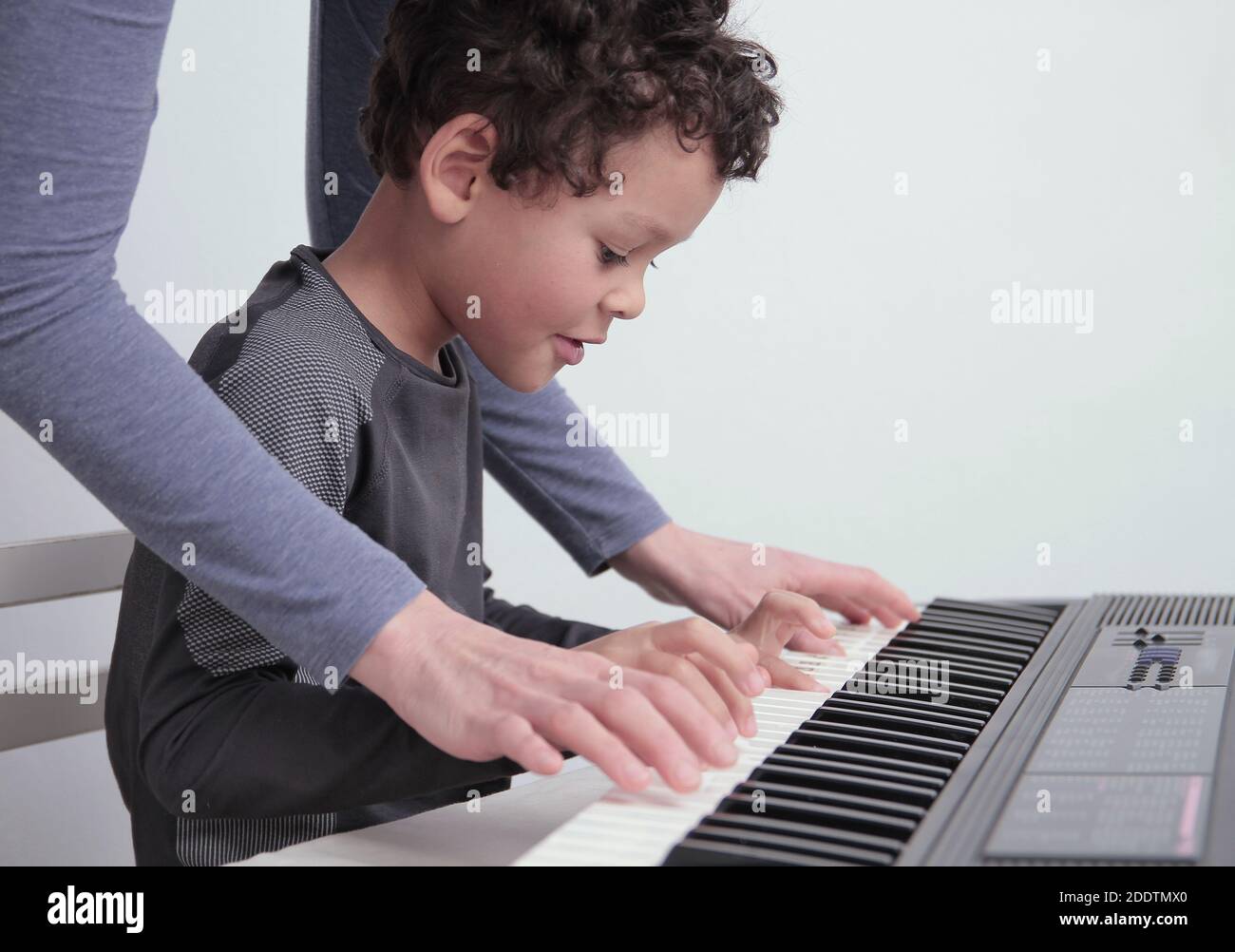 boy playing the piano keyboard on white background stock photo Stock ...
