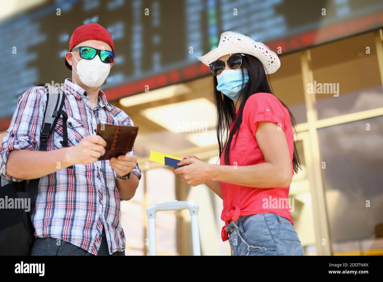 Two passenger check their international passports on platform for ...
