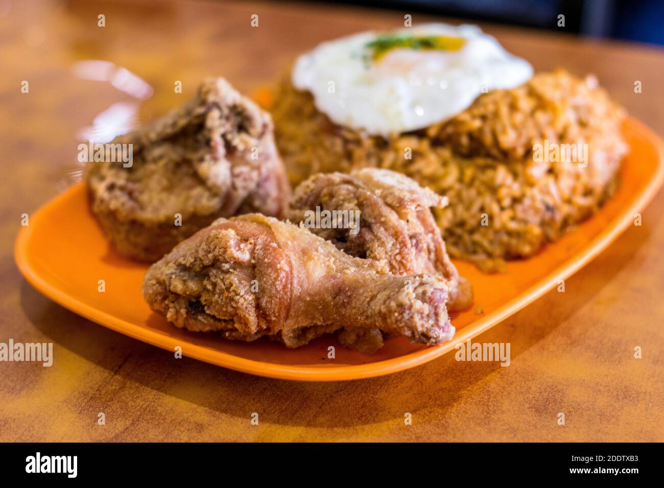 A plate of fried chicken and rice at a local asian restaurant in Makati ...