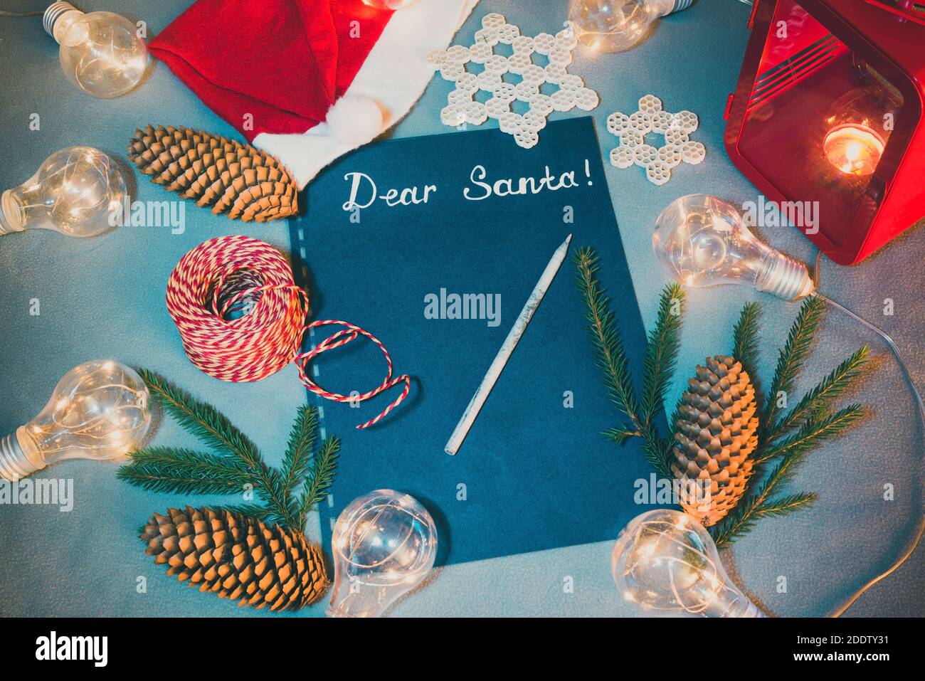 Blue color letter to santa claus decorated with christmas items with ...