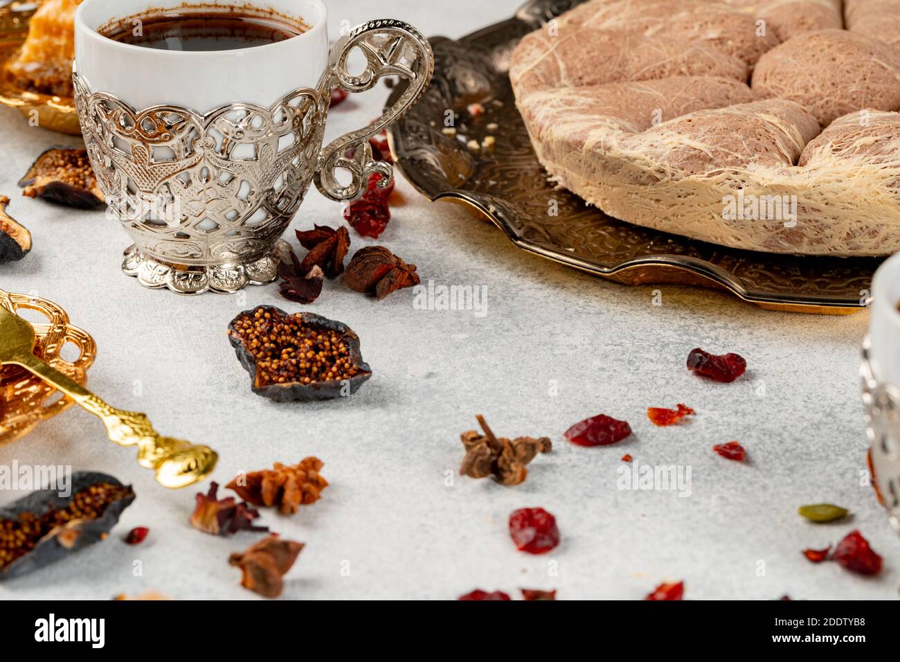 Turkish pastries and scattered dry fruits on table Stock Photo - Alamy