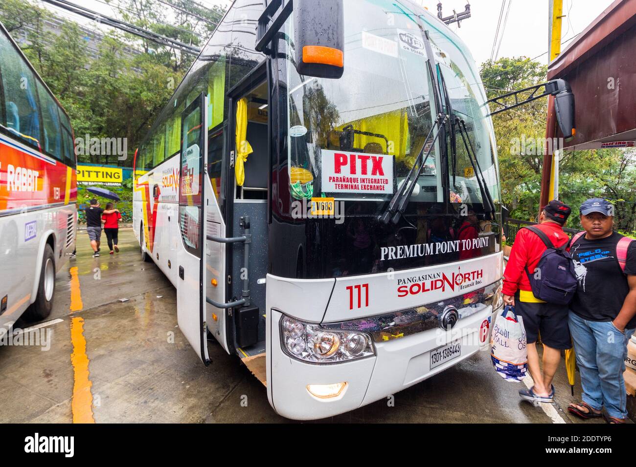 A bus bound for Manila at the bus station in Baguio City, Philippines ...