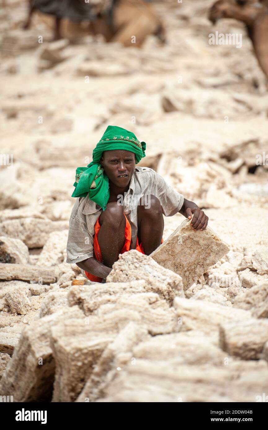 Salt miners working in the Danakil Depression salt fields in the Afar ...