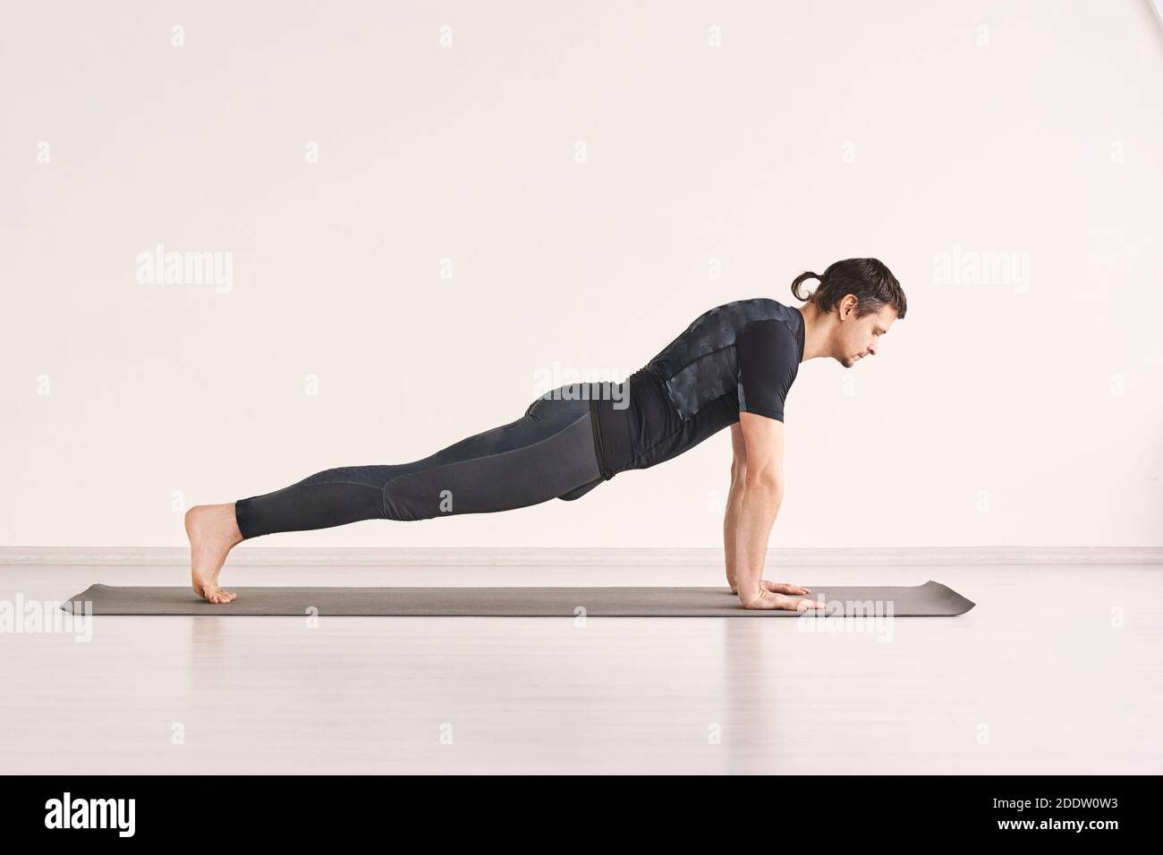 Man stand at plank. Home sport static training Stock Photo - Alamy