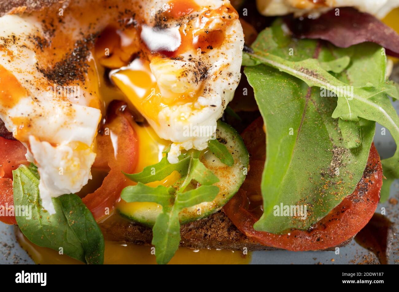 Macro photo of poached eggs. Spreading poached yolk. Detailing Stock ...