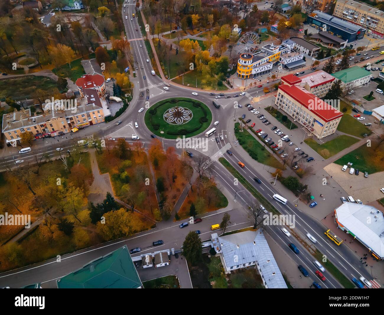 Aerial view of roundabout road with circular cars in small european ...