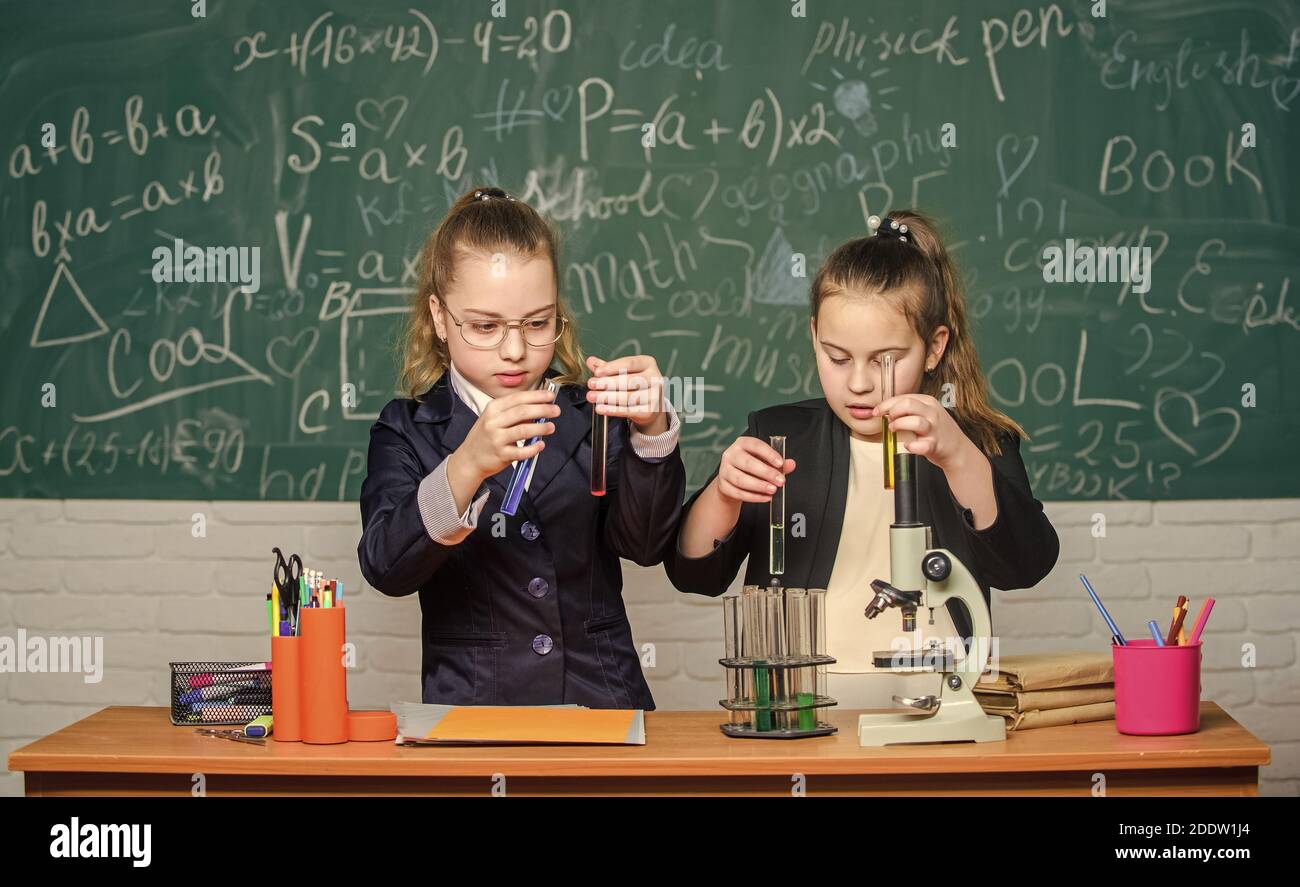 Doing research. Biology science. Happy little girls. Little girls ...
