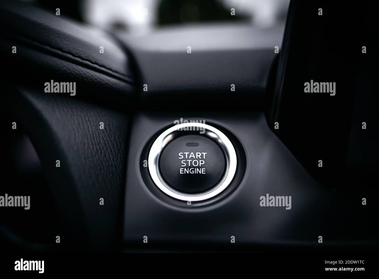 Close up Engine start stop button from a modern sport car black luxury ...