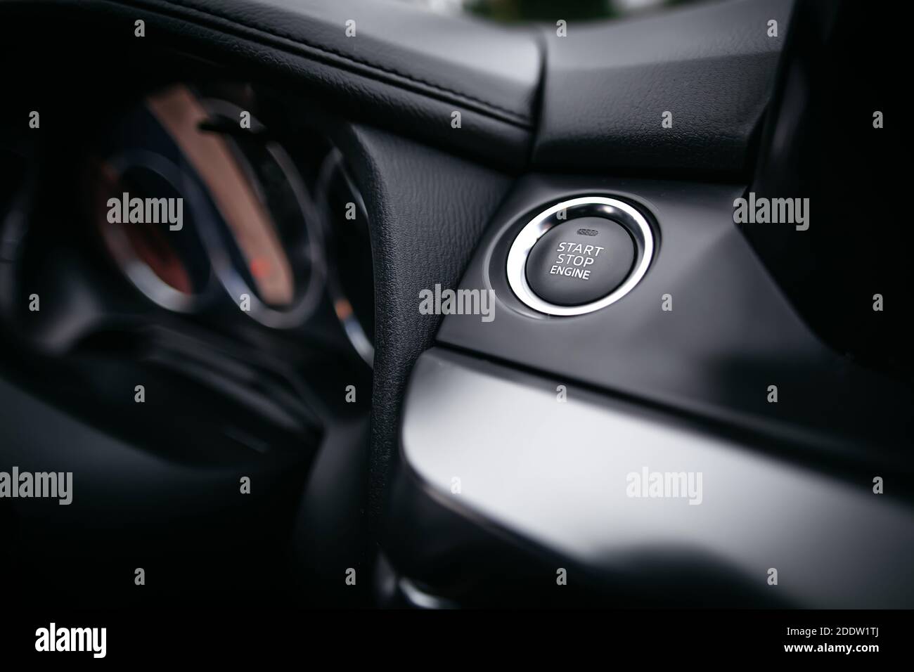Close up Engine start stop button from a modern sport car black luxury ...