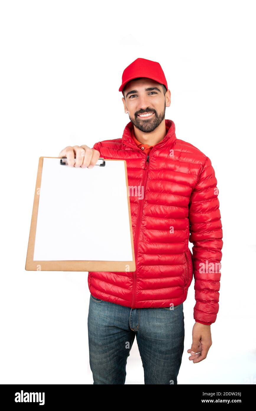 Delivery man giving the clipboard to a client to sign Stock Photo - Alamy