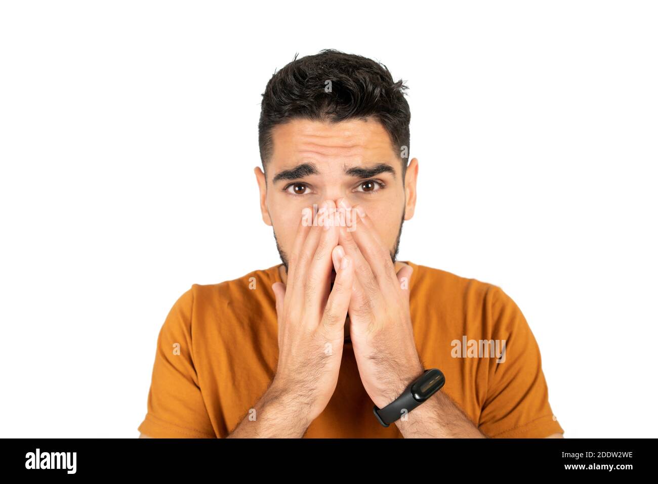 Portrait of young man looking scared Stock Photo - Alamy