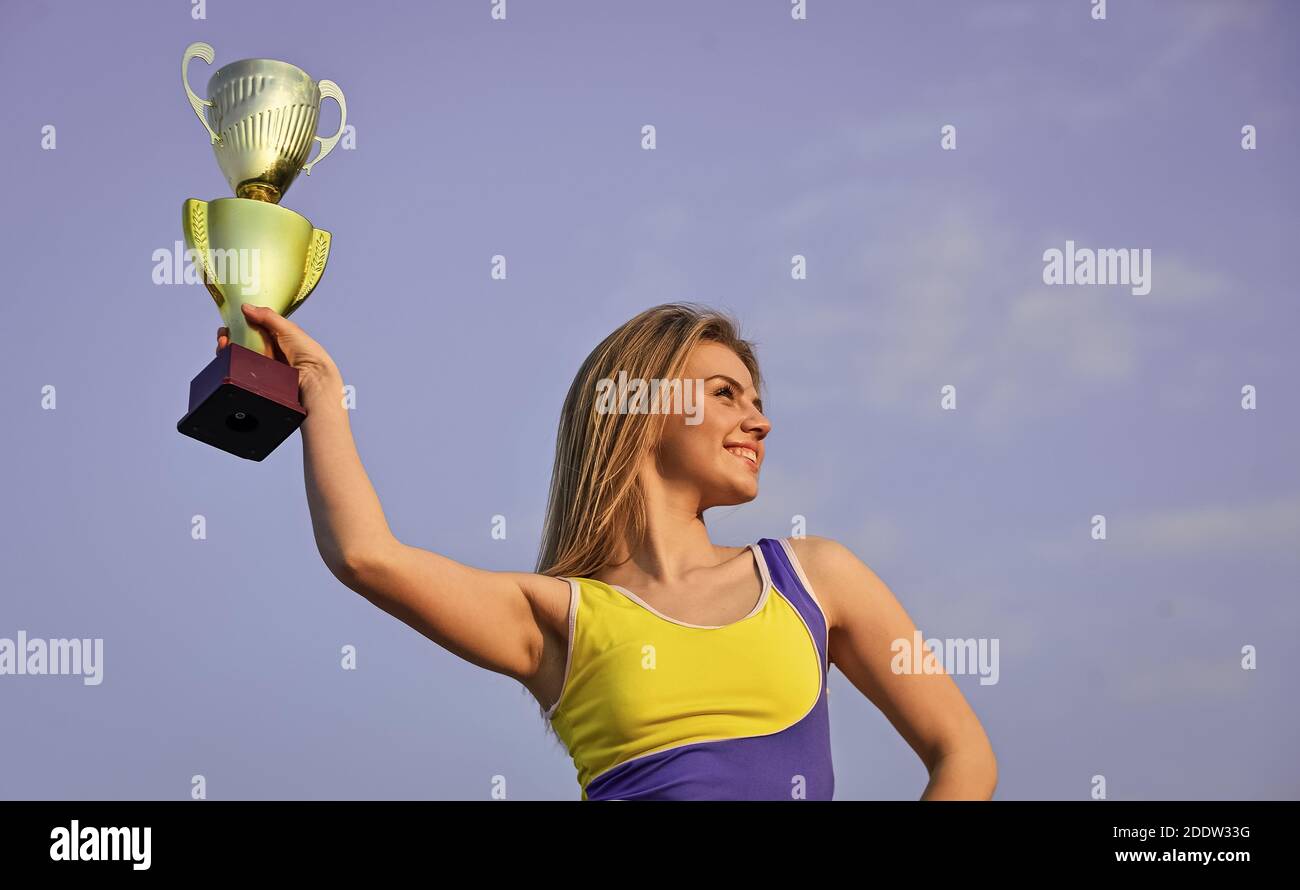 Sport success. Gold prize. Cute athlete being awarded with cup. First ...