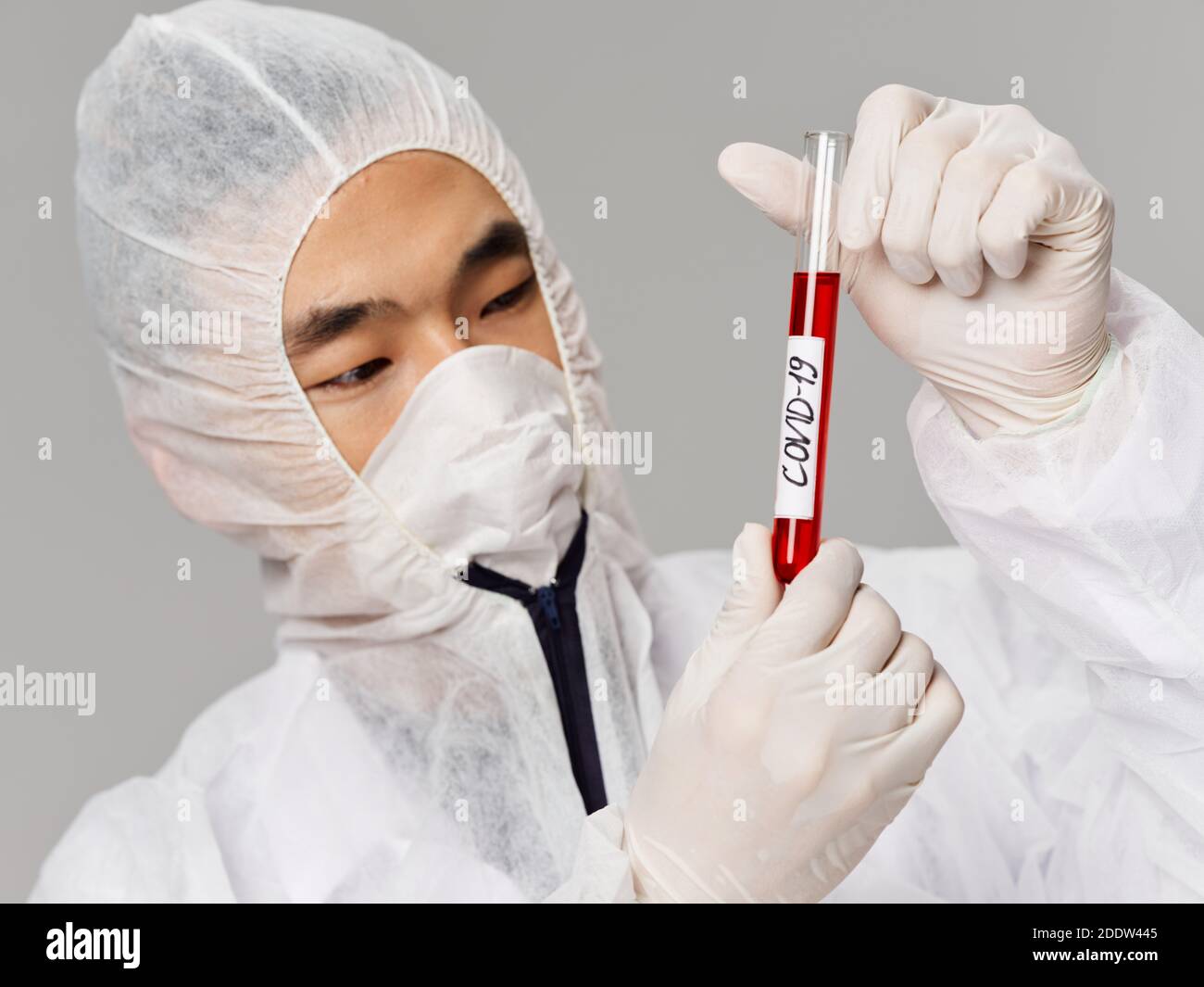 Man of Asian appearance laboratory protection analyzes testing ...