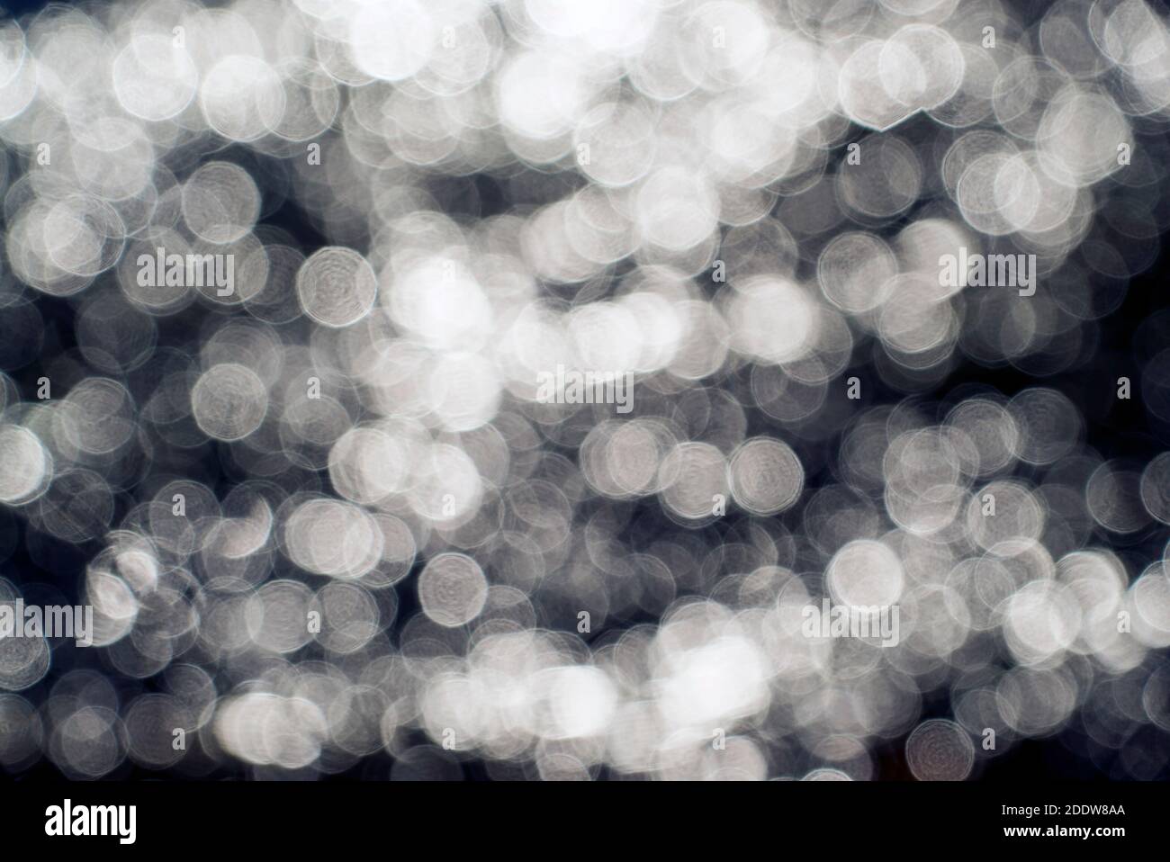 Glare on the water surface. Background image Stock Photo - Alamy