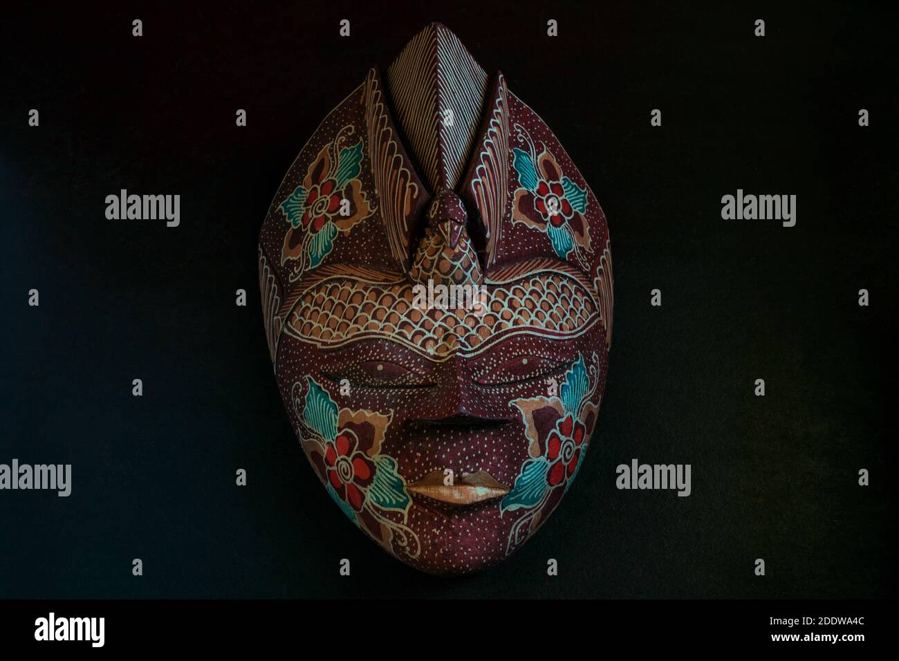 african ethnic tribal mask on dark background Stock Photo - Alamy