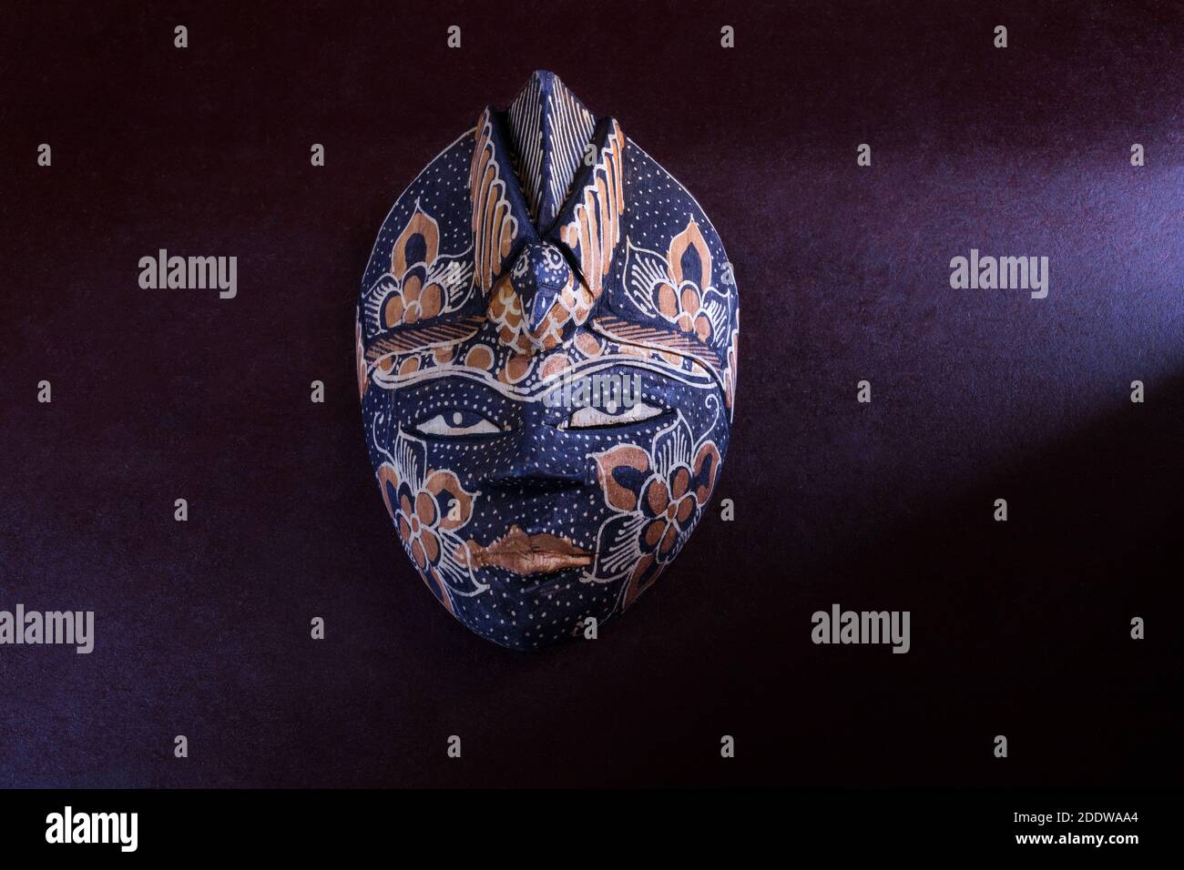 wooden colored african ethnic tribal mask on dark background Stock ...