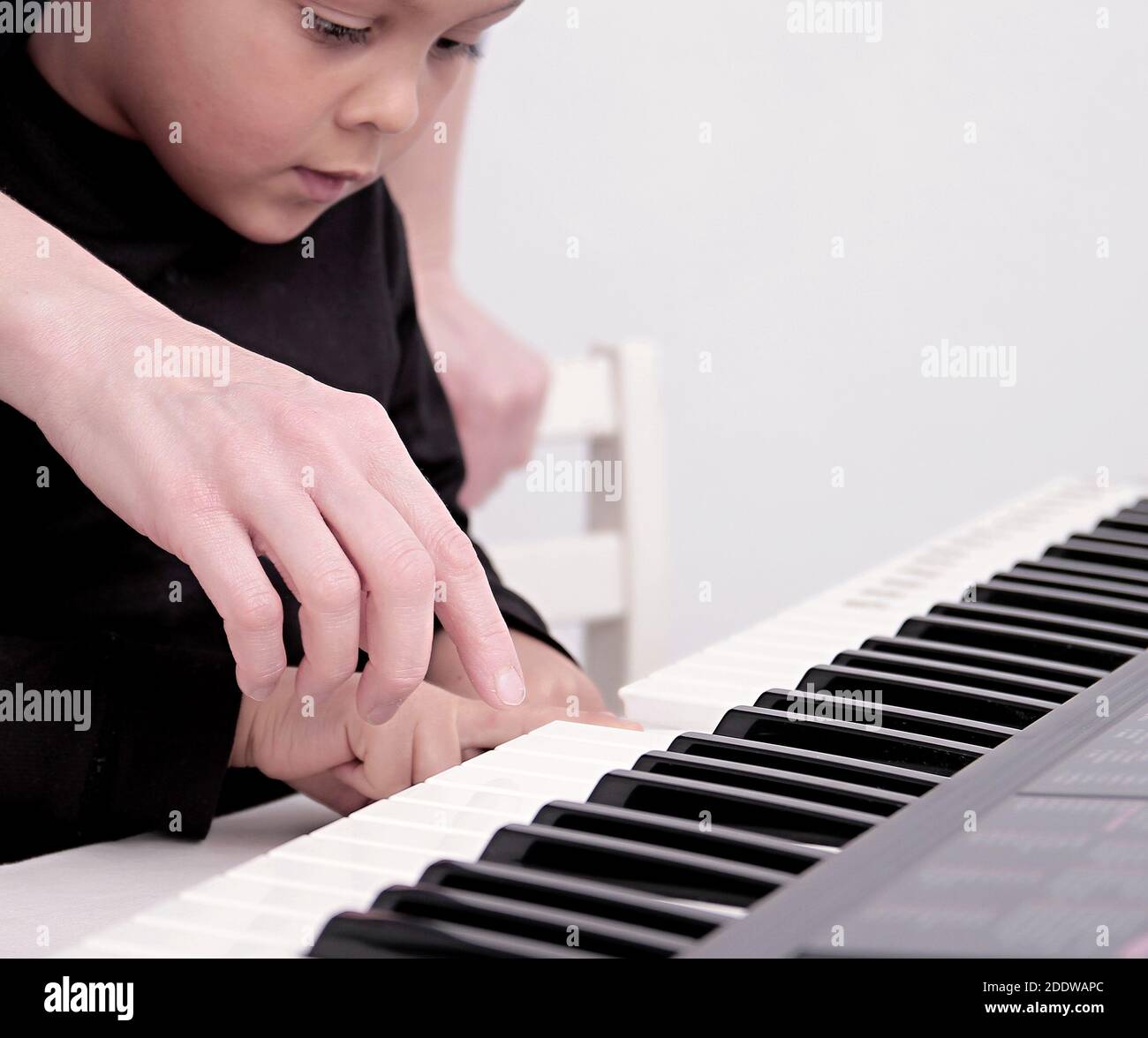 boy playing the piano keyboard on white background stock photo Stock ...