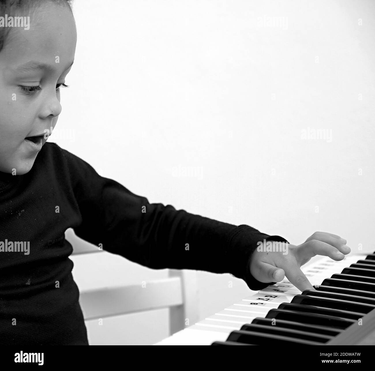 boy playing the piano keyboard on white background stock photo Stock ...