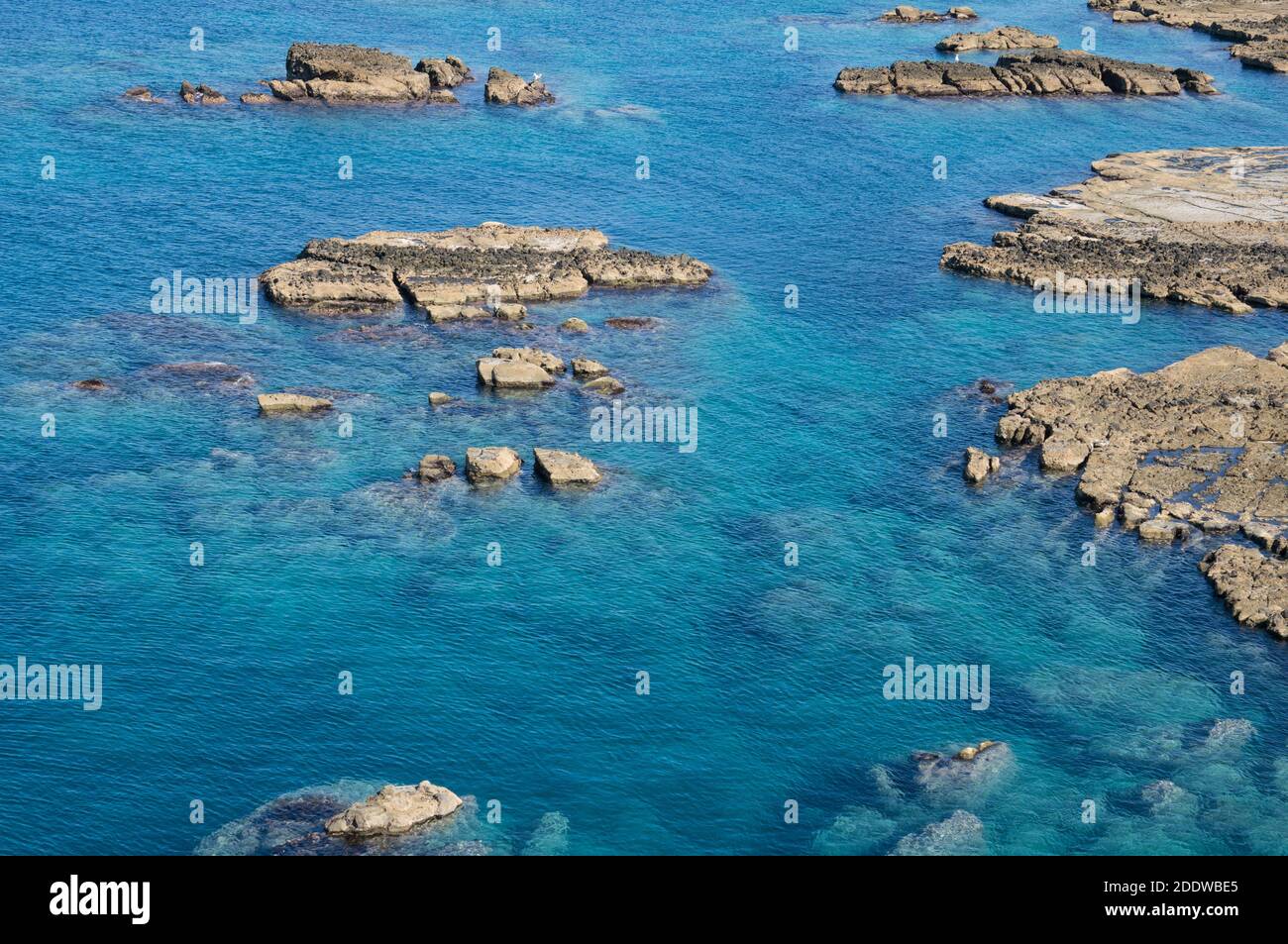 Stones in the water. Seascape top view Stock Photo - Alamy
