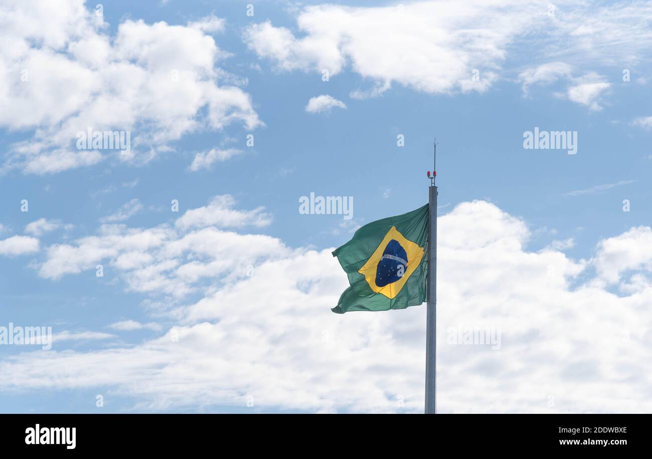 Brazil's flag. Blue sky and clouds. Symbol of the republic ...