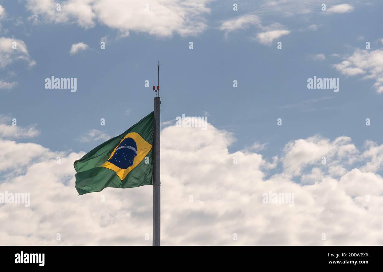 Brazil's flag. Blue sky and clouds. Symbol of the republic ...