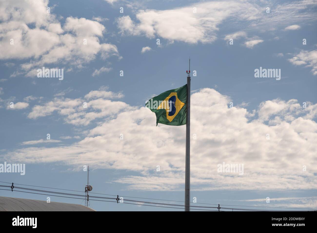 Brazil's flag. Blue sky and clouds. Symbol of the republic ...