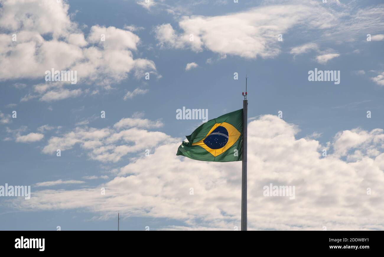 Brazil's flag. Blue sky and clouds. Symbol of the republic ...