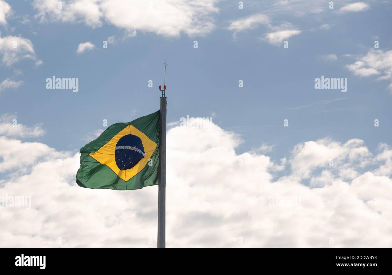 Brazil's flag. Blue sky and clouds. Symbol of the republic ...