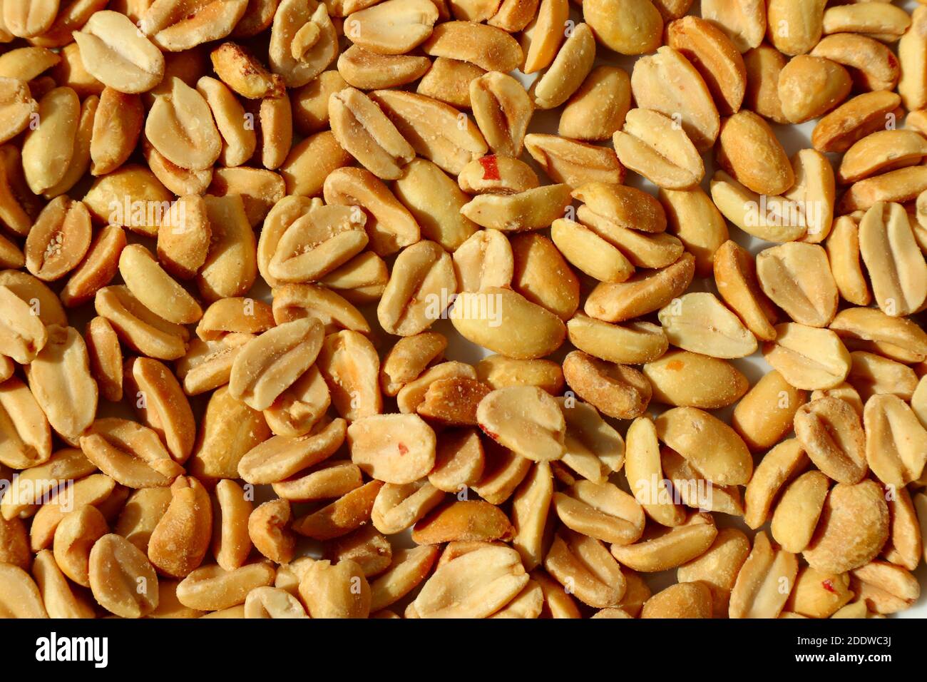 Peeled roasted peanuts texture Stock Photo - Alamy