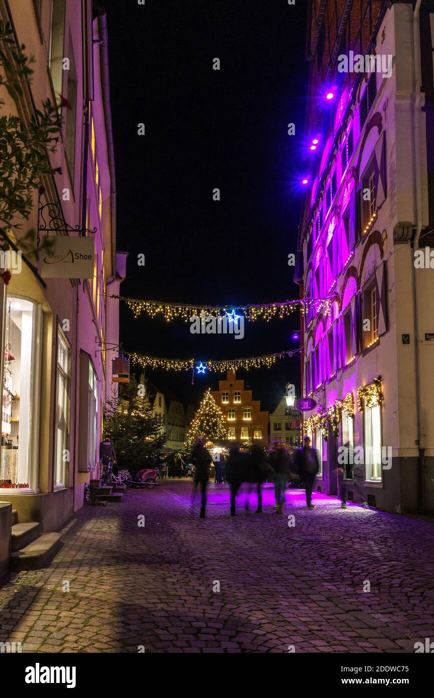 Festive decorated street with lights at advent time in old german town ...